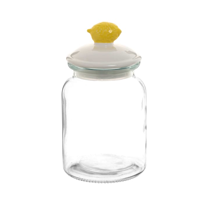 Bocal en verre transparent et couvercle en céramique avec citron jaune ...