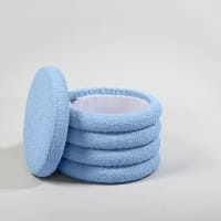 Pouf design 4 pieds en tissu bouclé gris Madelon | Maisons du Monde