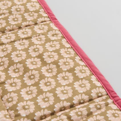 Fasciatoio per neonati nomade color ocra con motivi floreali gialli e ...