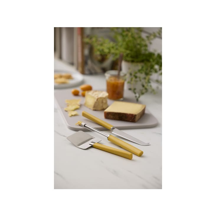 Coupe-fromage en acier curry Emma | Maisons du Monde